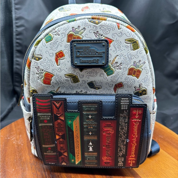 Loungefly | Bags | Loungefly Dumbledore Books Backpack Gray And ...